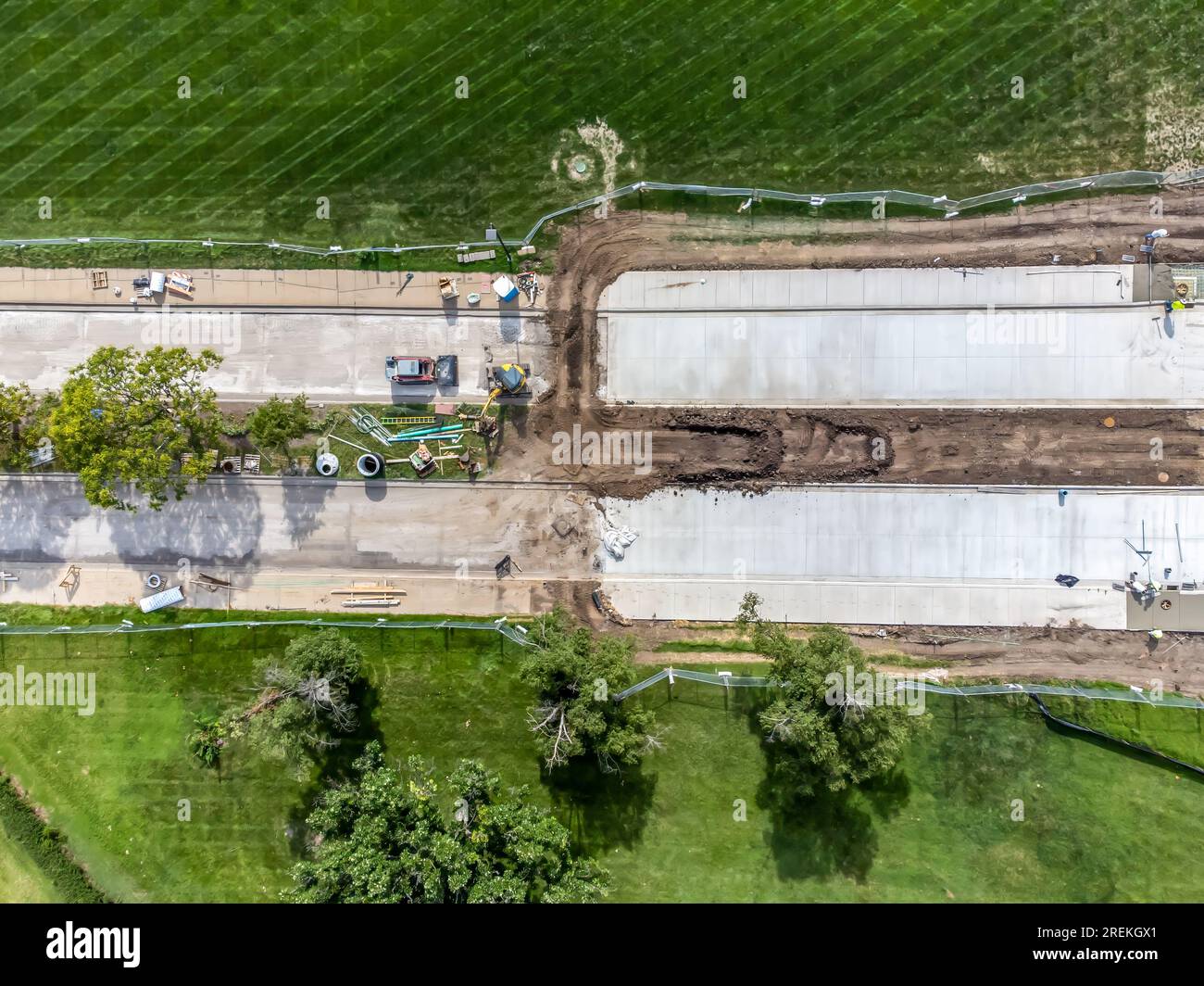 Overhead view of road construction on a partitioned road with tracked ...