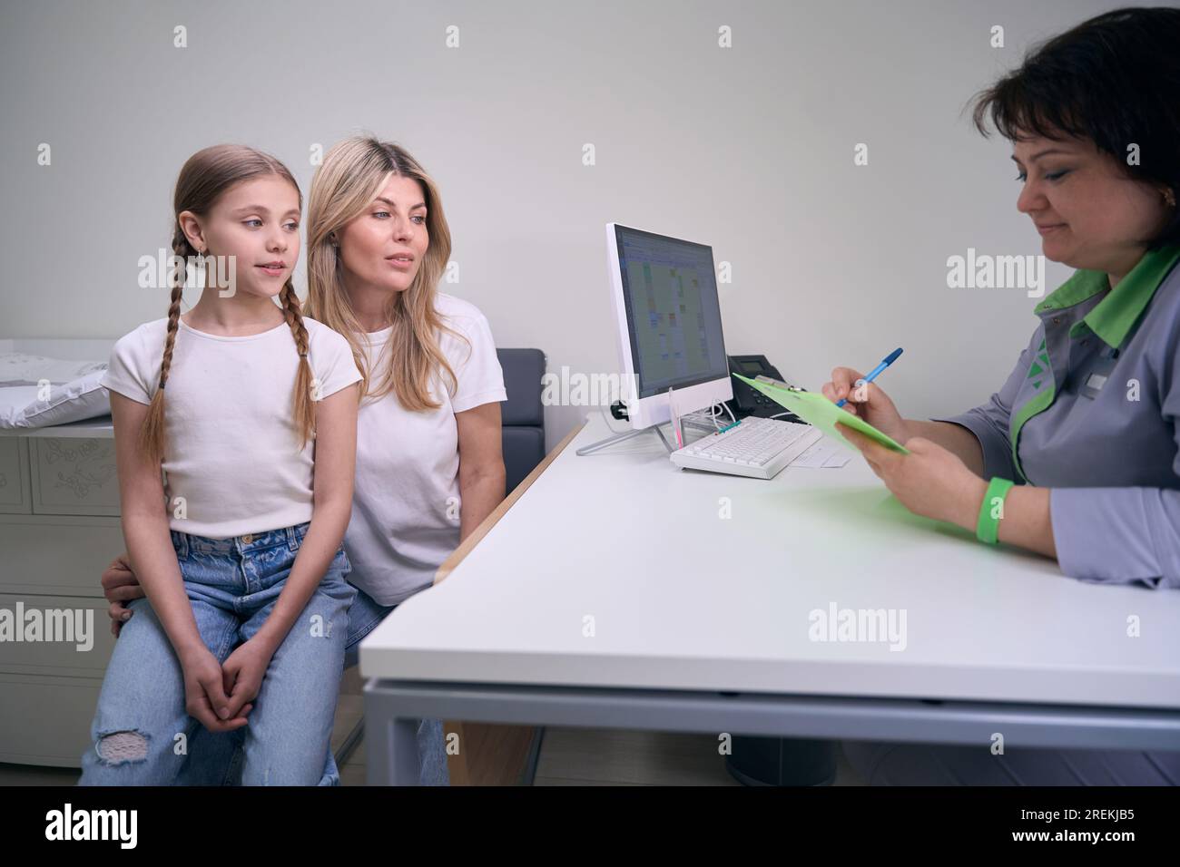 Mom and daughter at the appointment with a pediatric allergist Stock ...