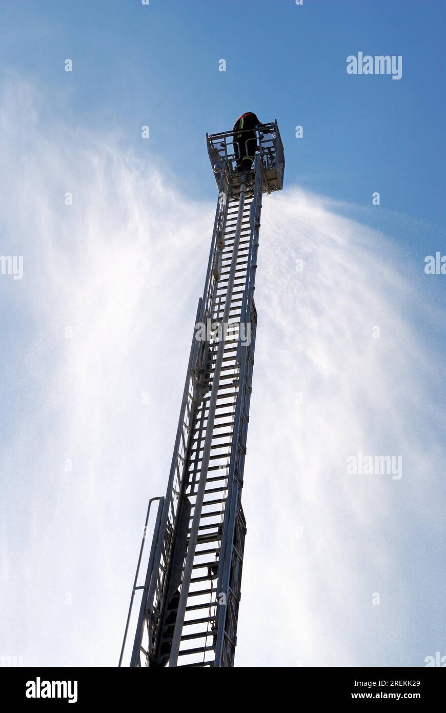 Firefighter on a high ladder Stock Photo - Alamy