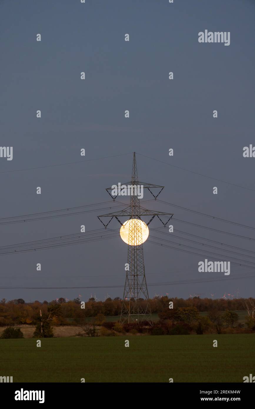 Moon with lattice mast Overhead line Stock Photo - Alamy