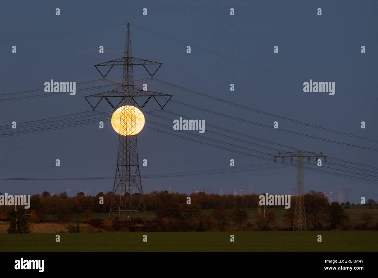 Moon with lattice mast Overhead line Stock Photo - Alamy