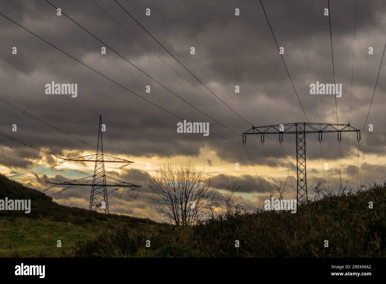 High voltage line Overhead line Sunset Stock Photo - Alamy