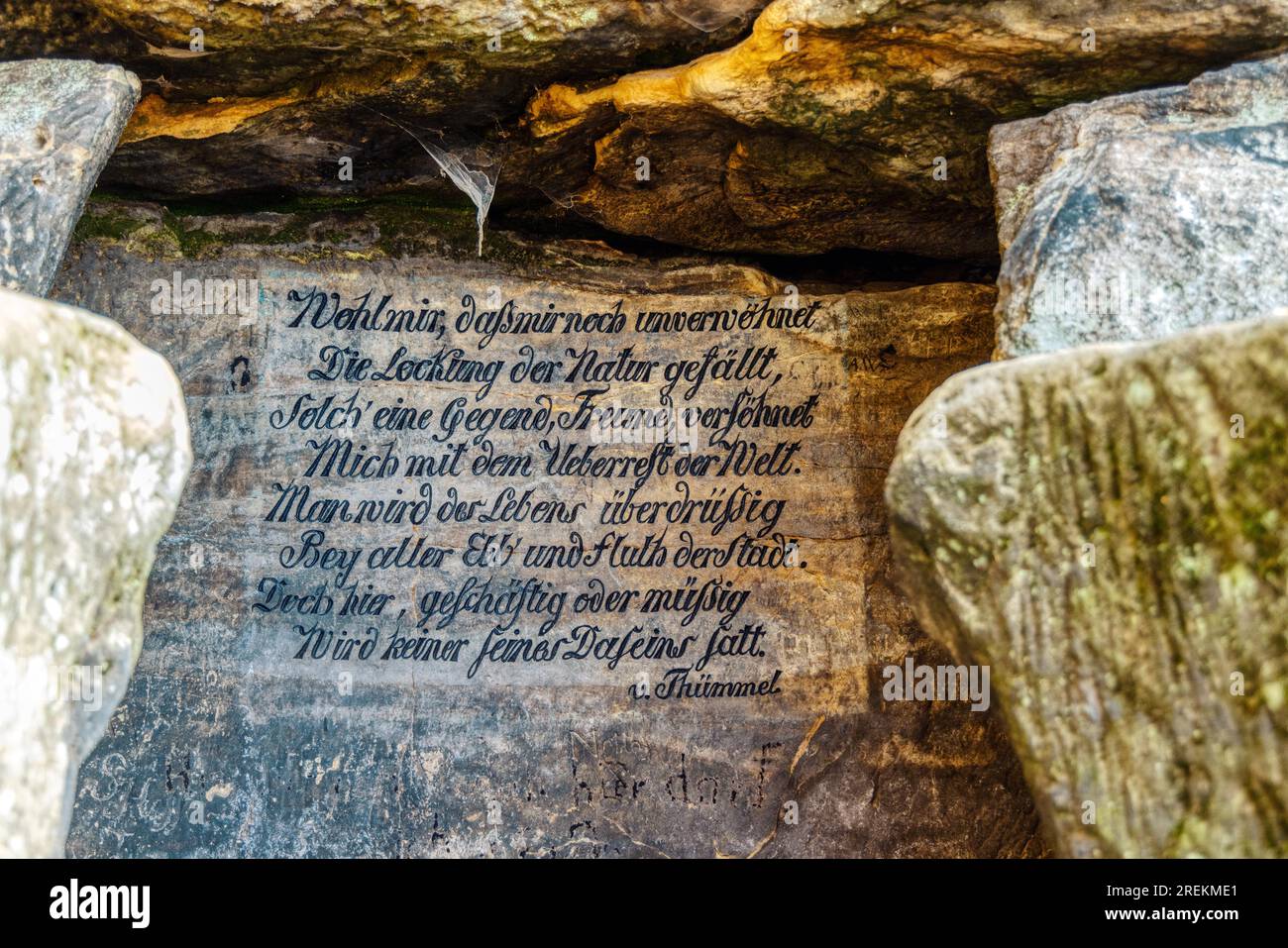 Inscription on the rock tablet on the fire Stock Photo - Alamy