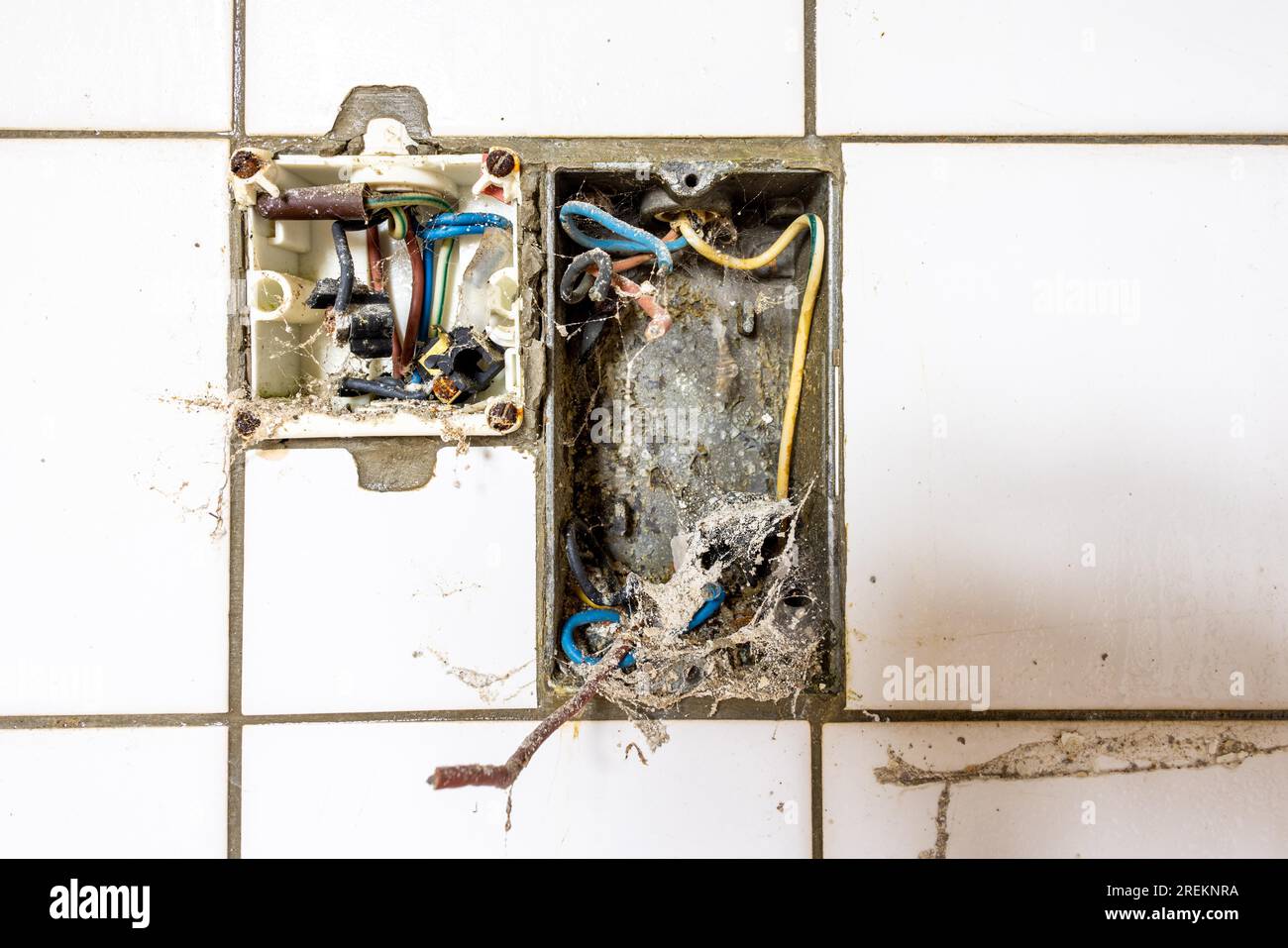 Old flush-mounted box and switch box electrical system Stock Photo - Alamy