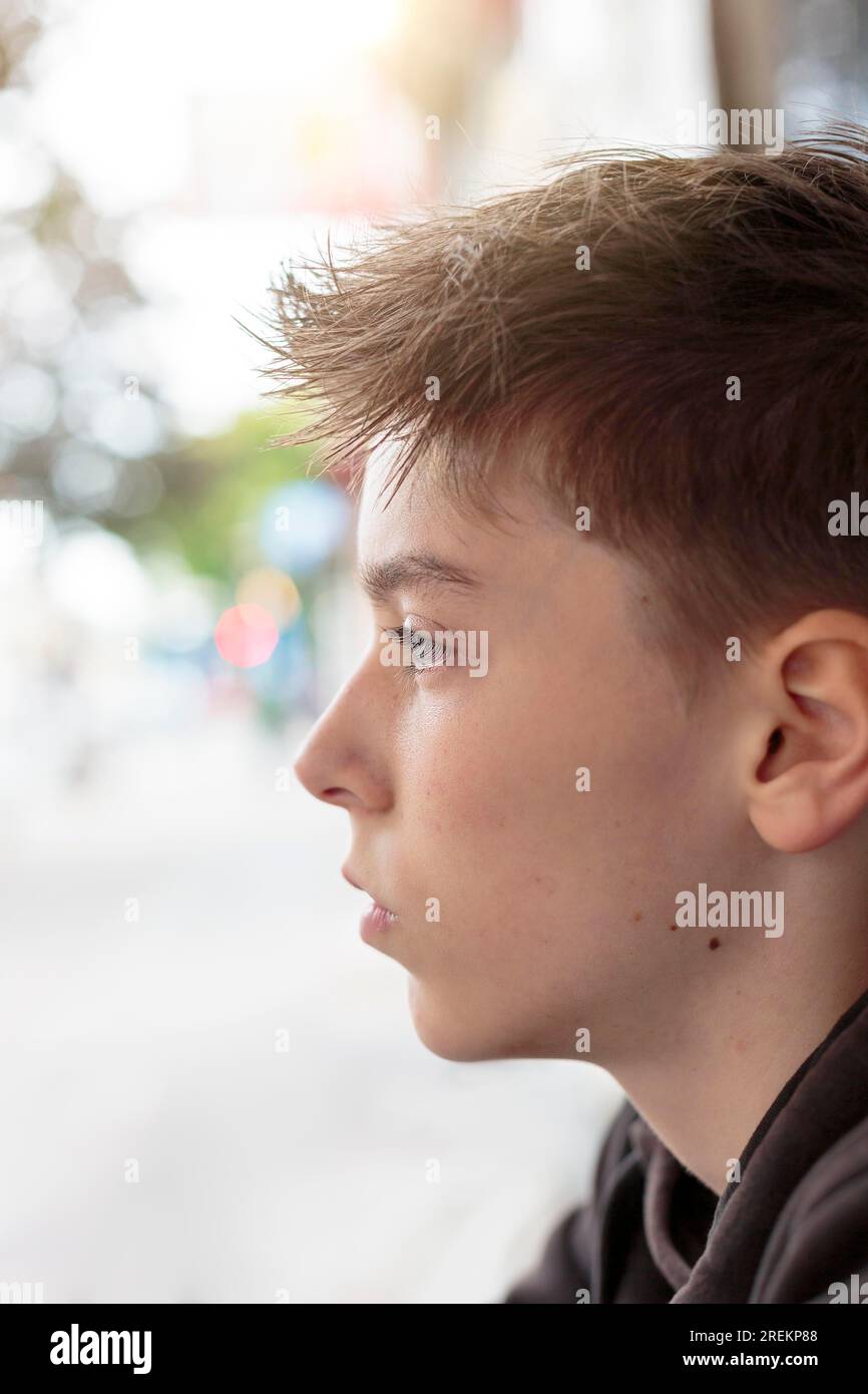 Portrait of a teenage boy in profile Stock Photo - Alamy