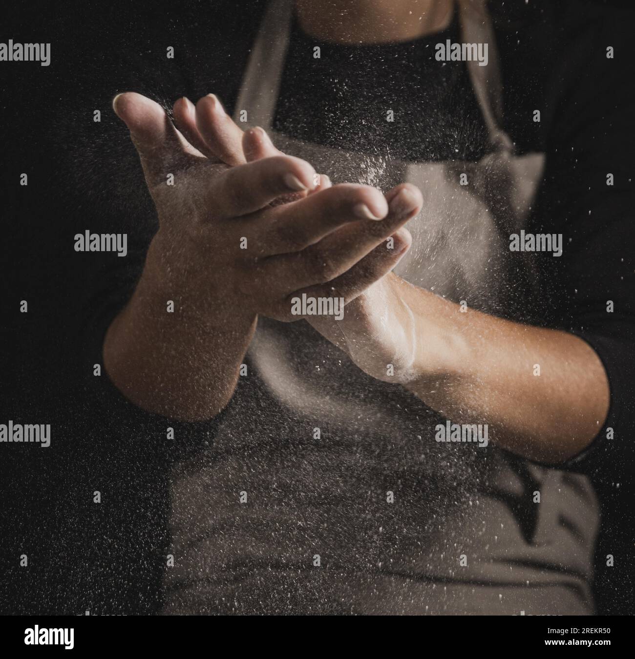 Close up baker cleaning hands off flour. Resolution and high quality ...