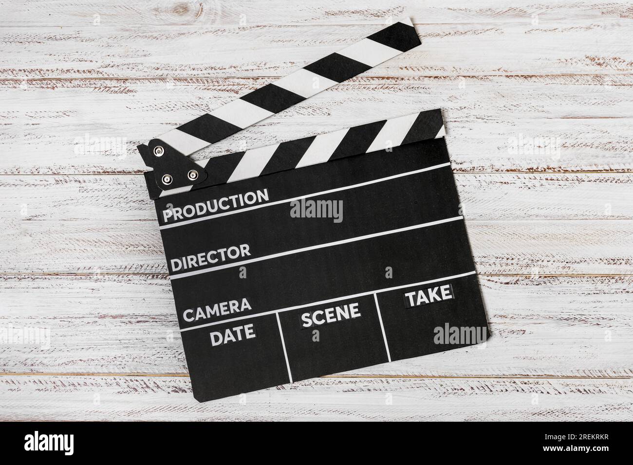 Elevated view clapperboard white wooden desk. Resolution and high quality beautiful photo Stock ...