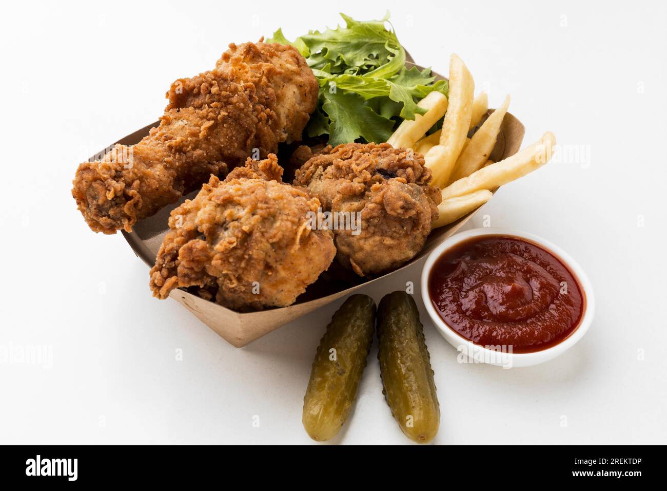 High angle fried chicken drumsticks with ketchup fries. Resolution and ...