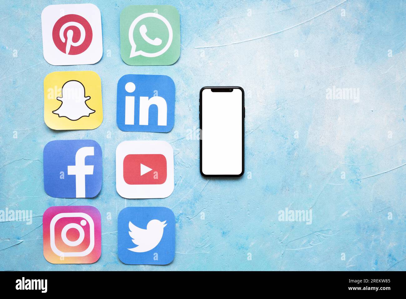 Paper cut outs social media icons arranged near smartphone. Resolution ...