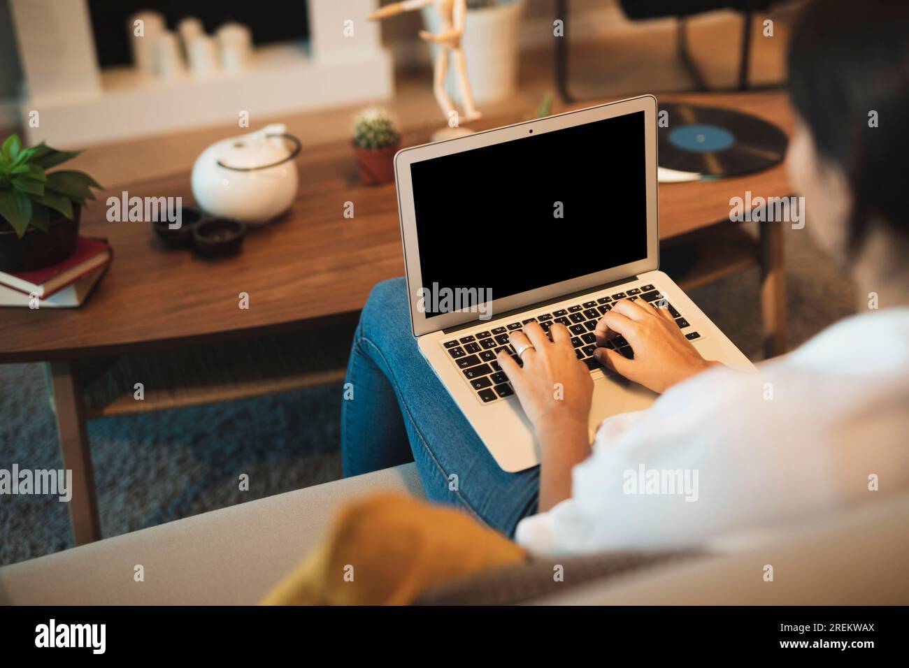 Back view hands writing laptop mock up. Beautiful photo Stock Photo - Alamy