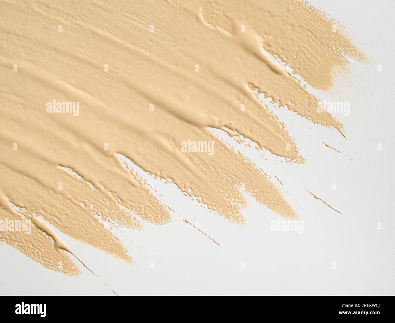 Abstract foundation stain white background Stock Photo - Alamy