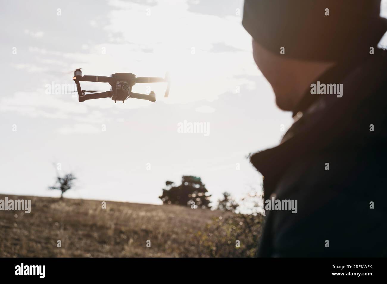 Close up man watching drone. Beautiful photo Stock Photo - Alamy