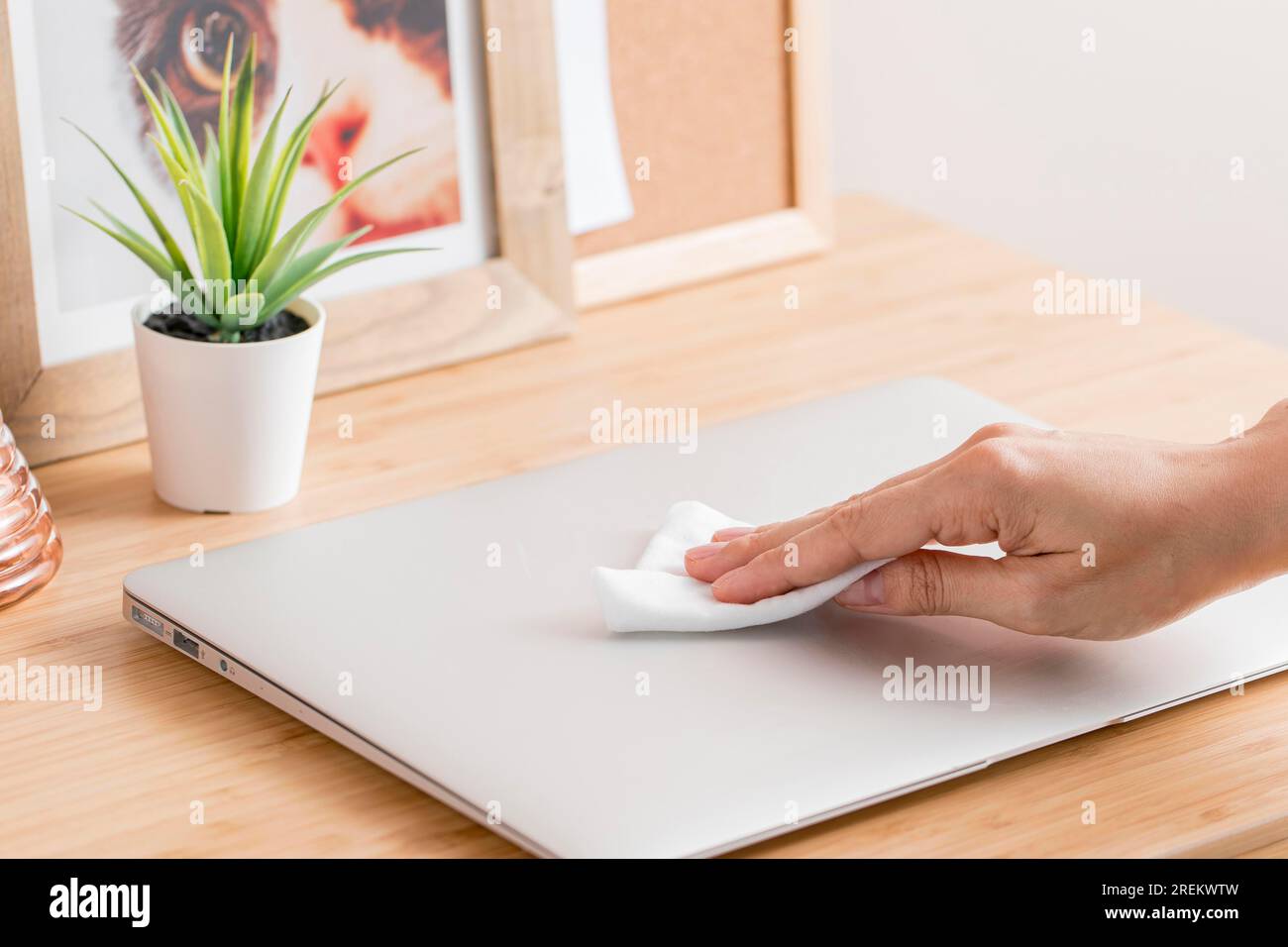High angle hand disinfecting laptop desk Stock Photo - Alamy