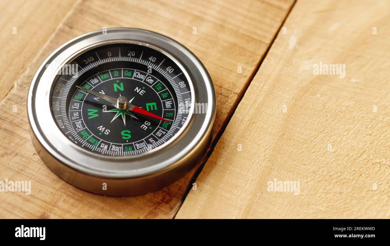 High angle compass wooden board with copy space Stock Photo - Alamy