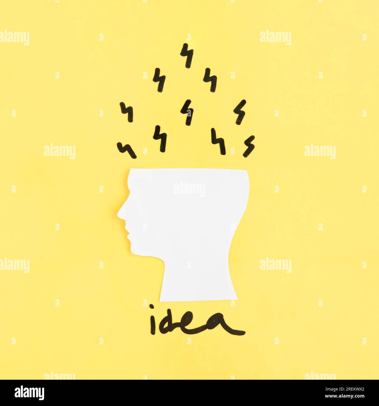 Ideas coming out from cutout brain Stock Photo - Alamy