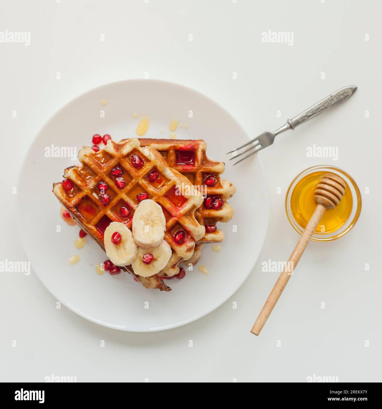 Top view waffle with honey fork. Beautiful photo Stock Photo - Alamy
