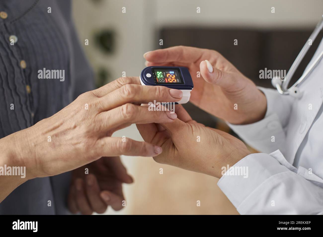 Covid recovery center female doctor checking elder patient s oxygen ...