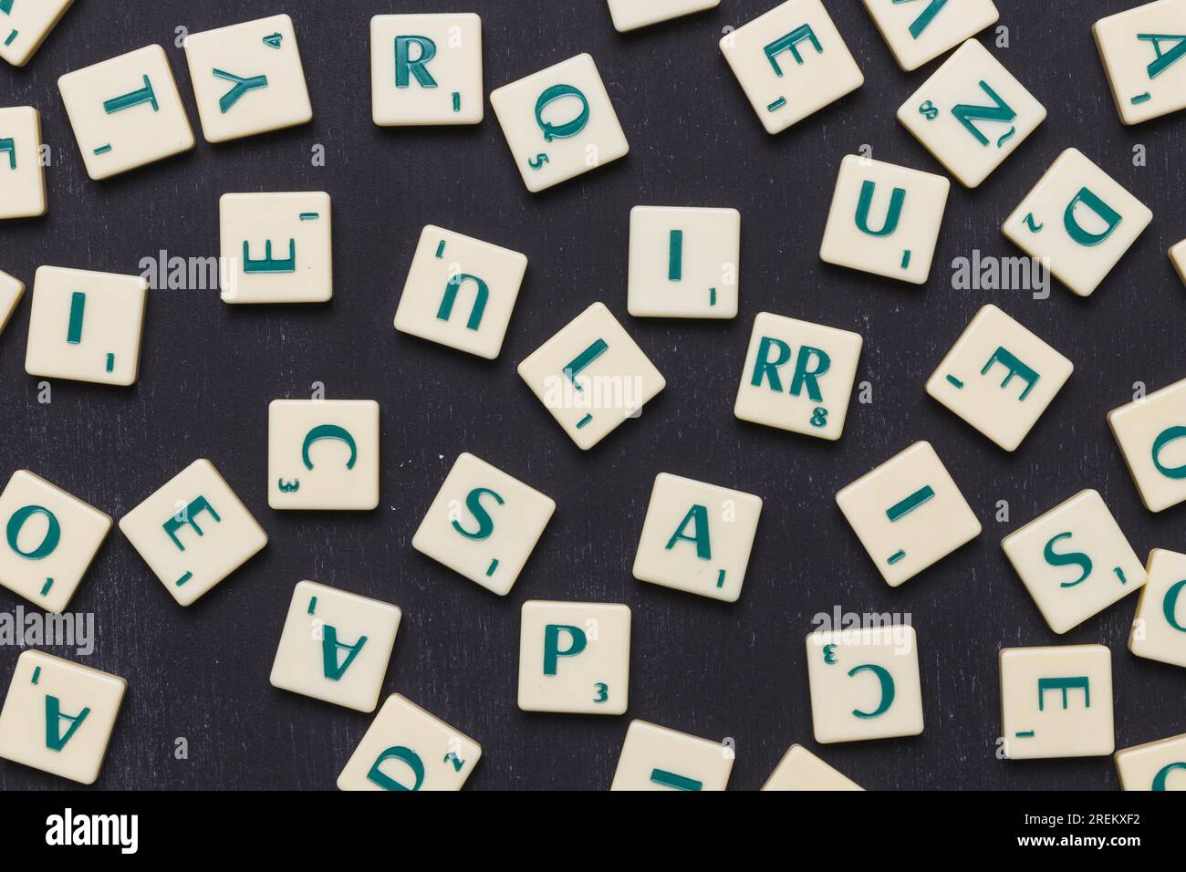 Close up scrabble letters against black background. High resolution ...