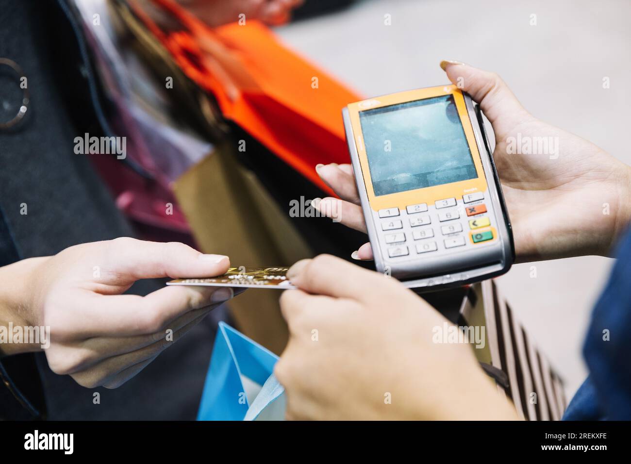 Crop customer assistant with paying machine. High resolution photo ...