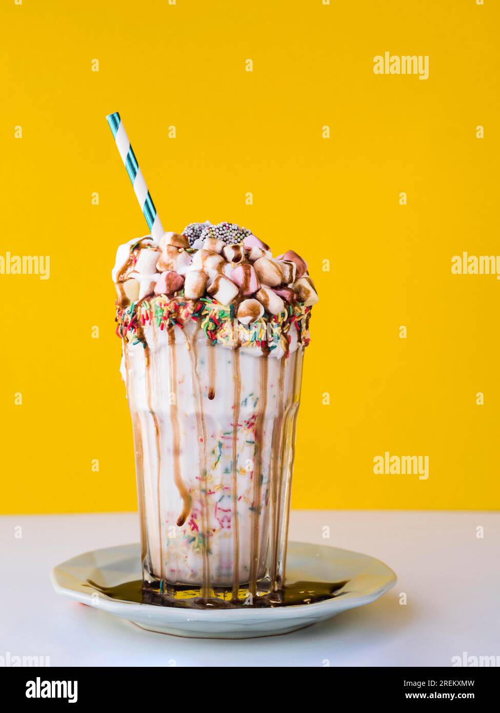 Front view delicious milkshake with yellow background. High resolution ...