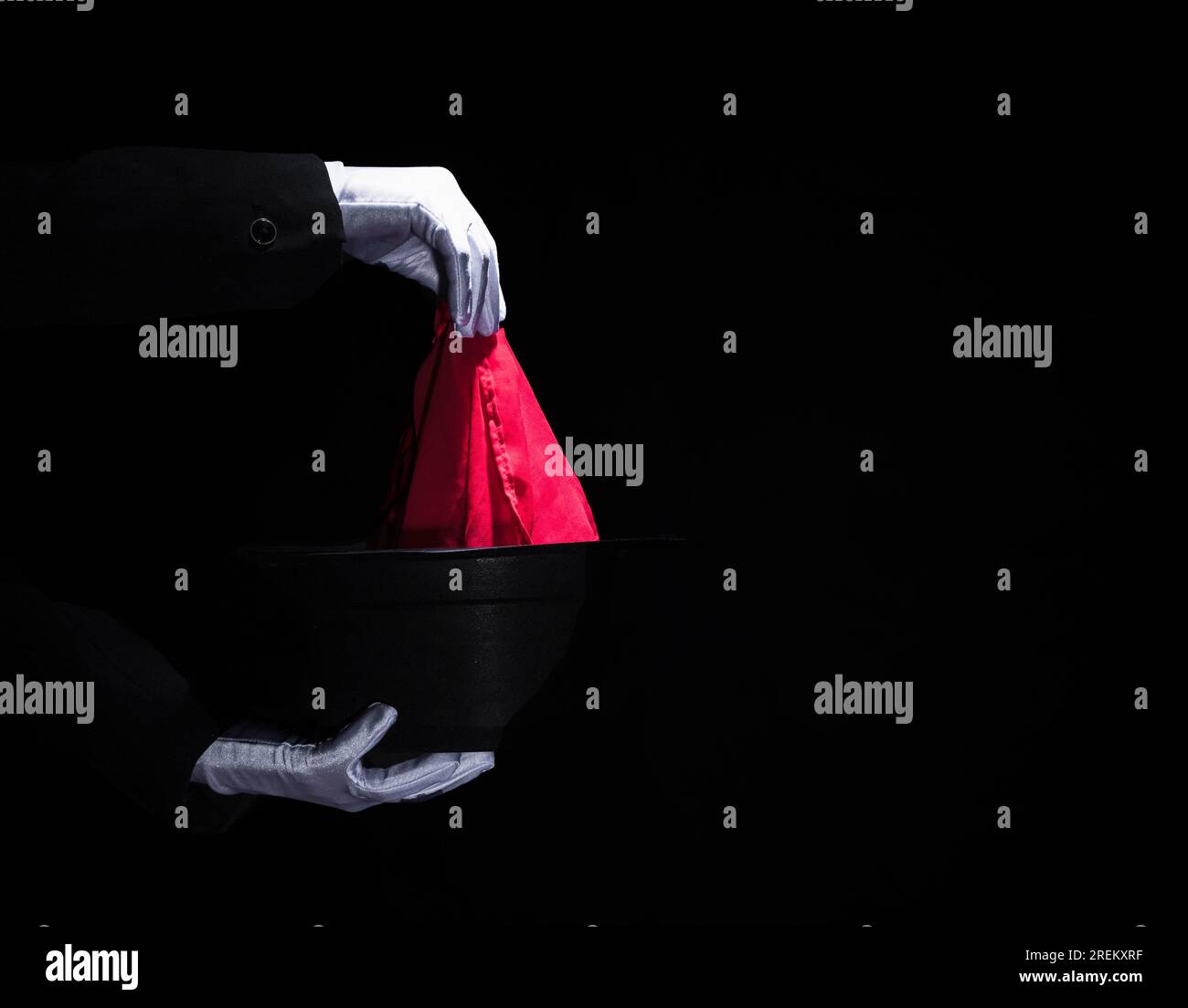 Magician s hand performing magic trick with napkin top black hat. High ...