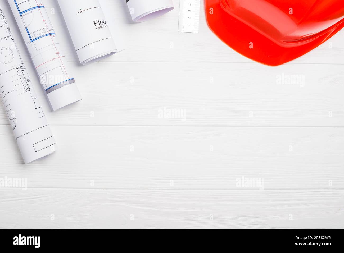 Hardhat blueprints wooden table. High resolution photo Stock Photo - Alamy