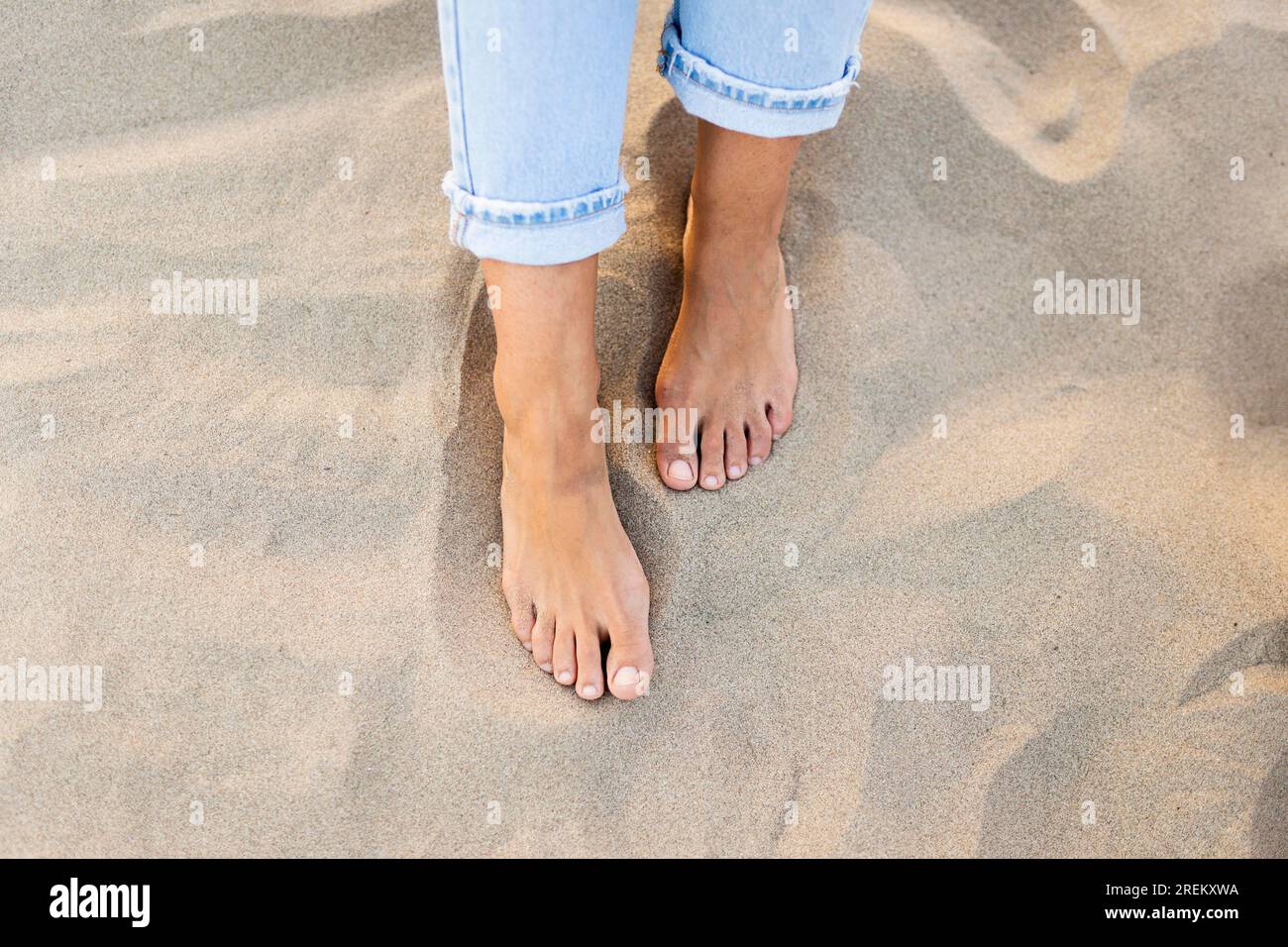 High angle woman feet sand beach. High resolution photo Stock Photo - Alamy