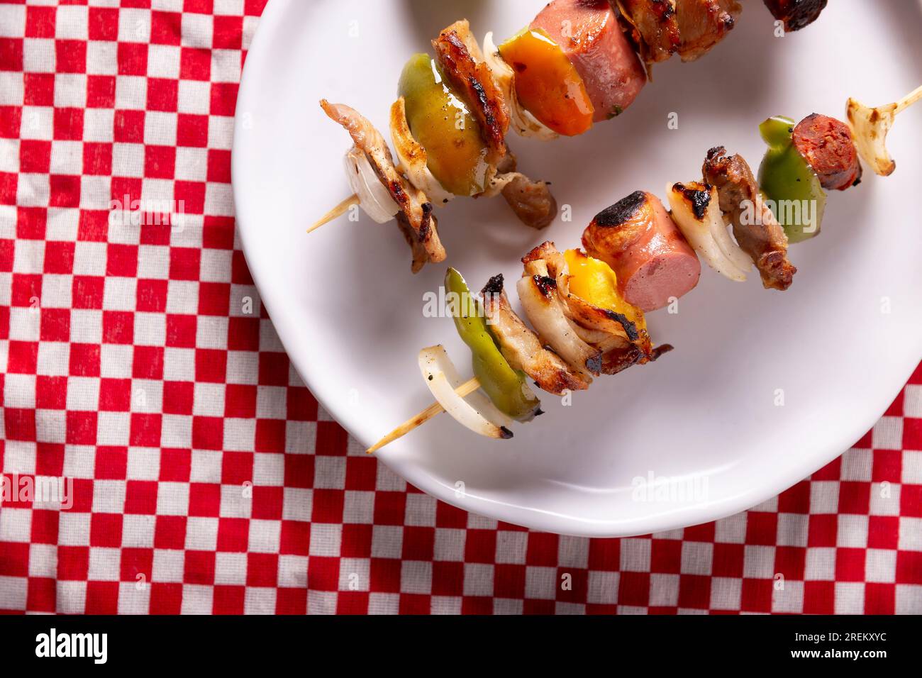 Homemade Skewers with meat and grilled vegetables served on a rustic ...