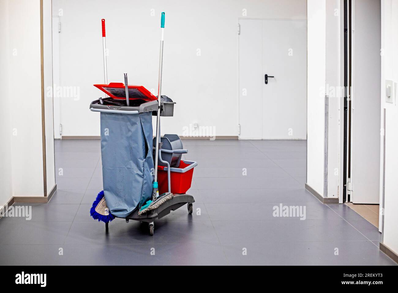 Classic cleaning trolley. Broom, bucket, detergents, cleaning products ...