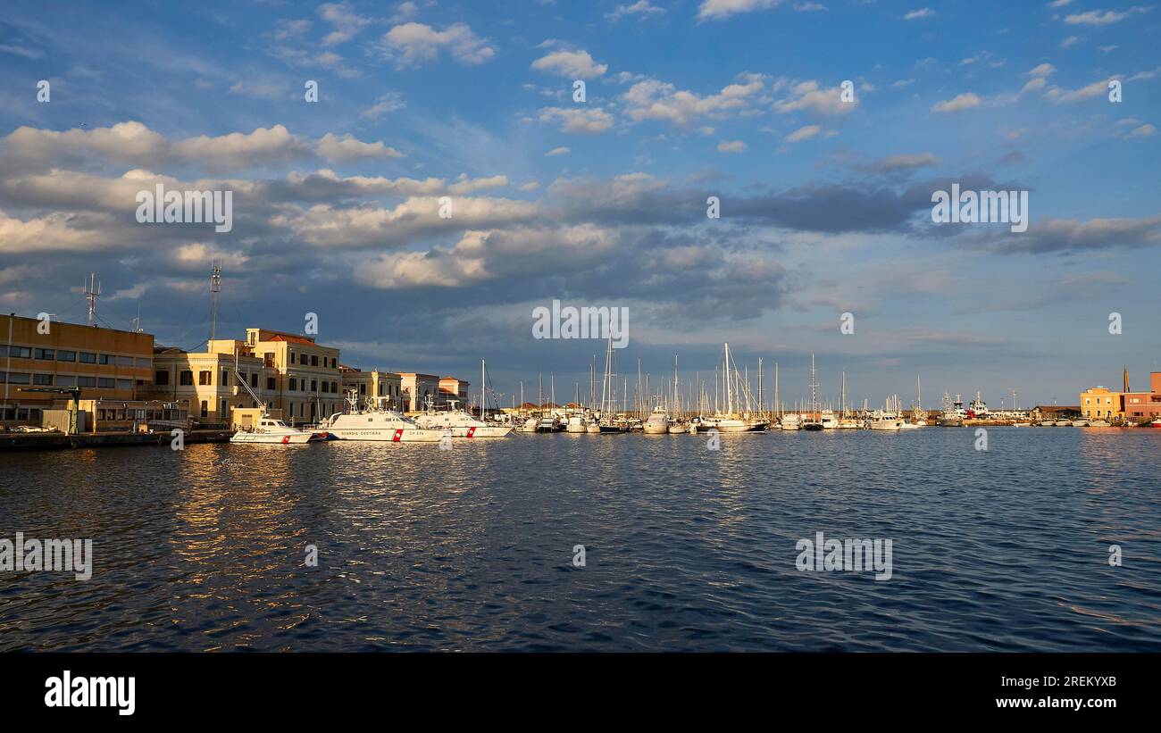 Evening light, harbour, Italian coast guard ships, sailboats, cloudy ...