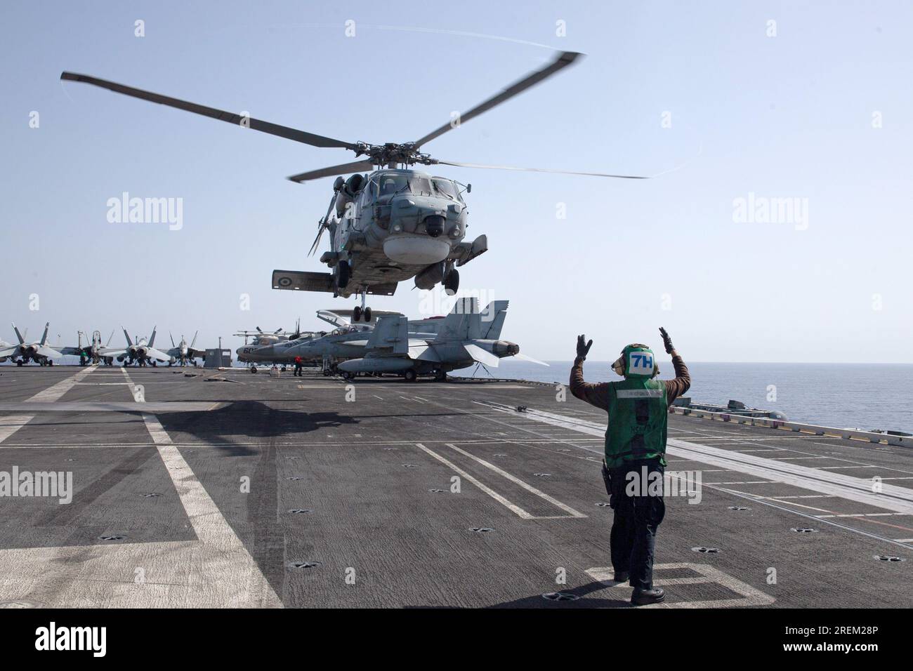 Helicopter lands on the flight deck of the USS Gerald R. Ford (CVN 78 ...