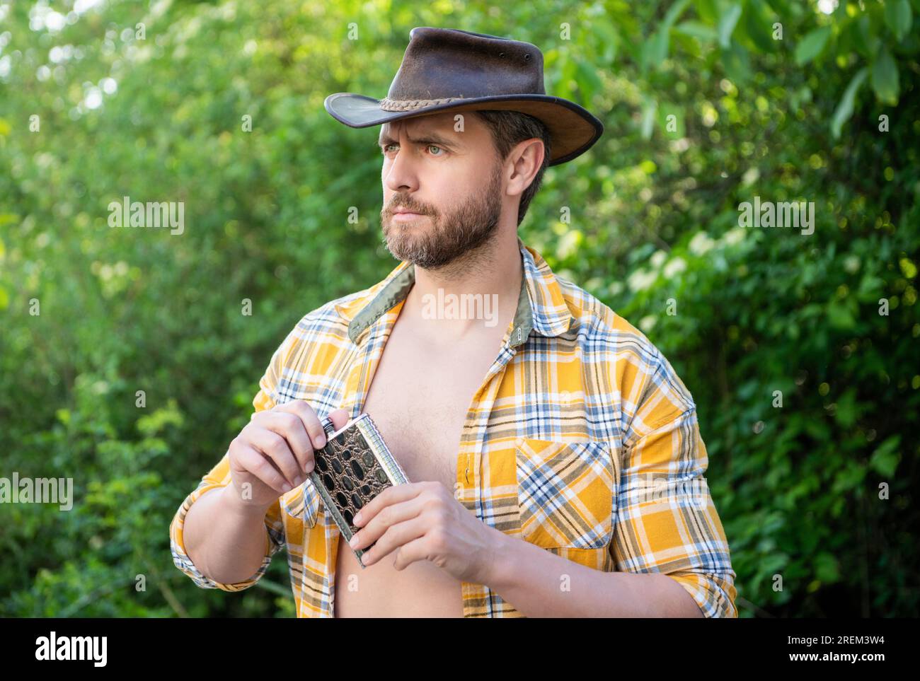 masculine cowboy with flask. masculine cowboy with flask outdoor ...