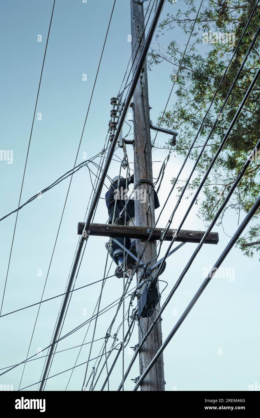 Man working on high voltage power lines hi-res stock photography and ...