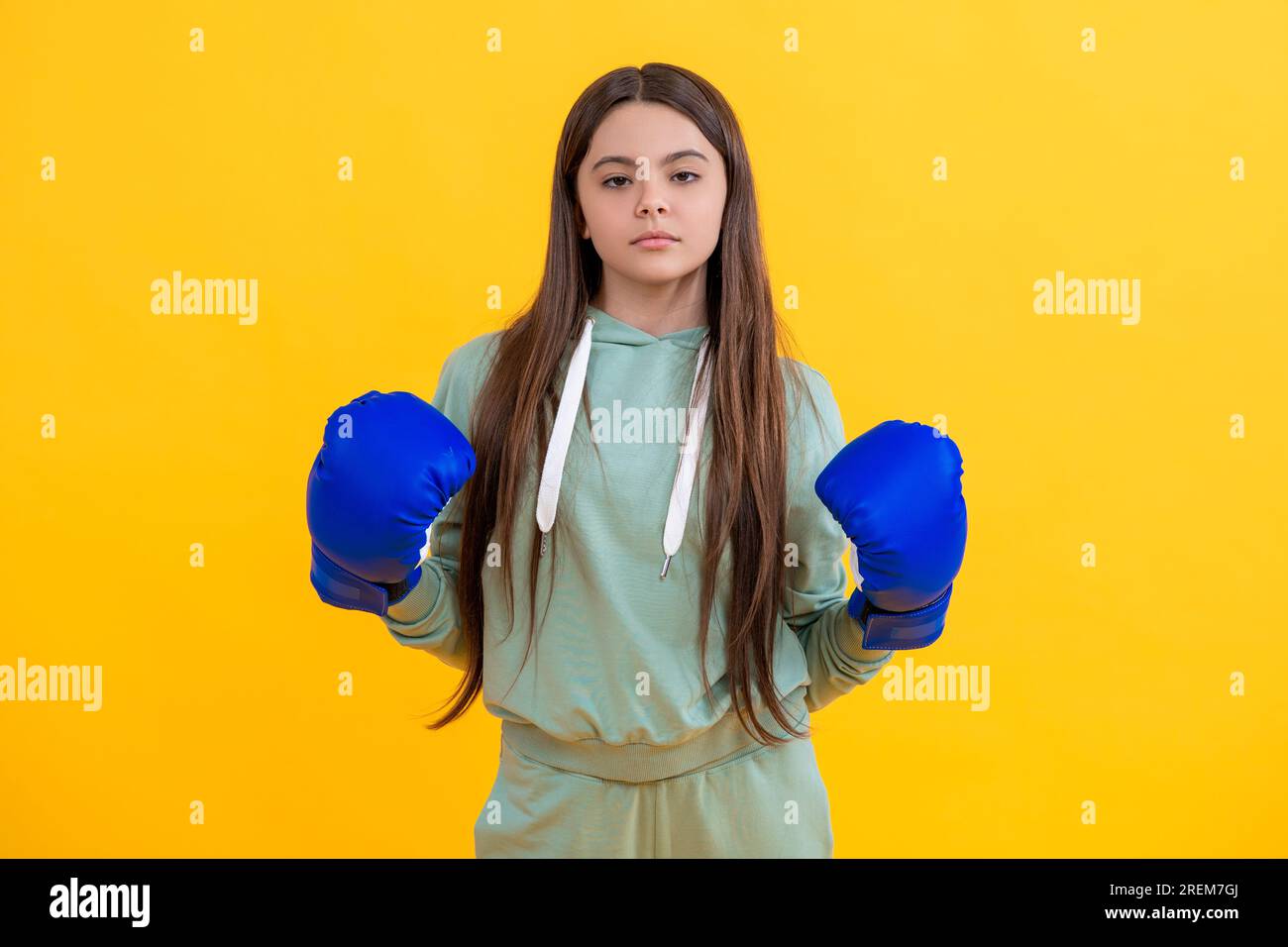 Teen boxer training with discipline and determination. teen girl in ...