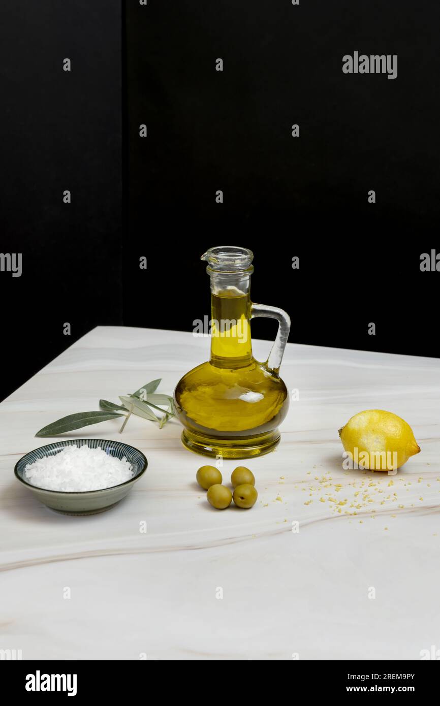 A beautiful still life with a glass container filled with virgin olive ...