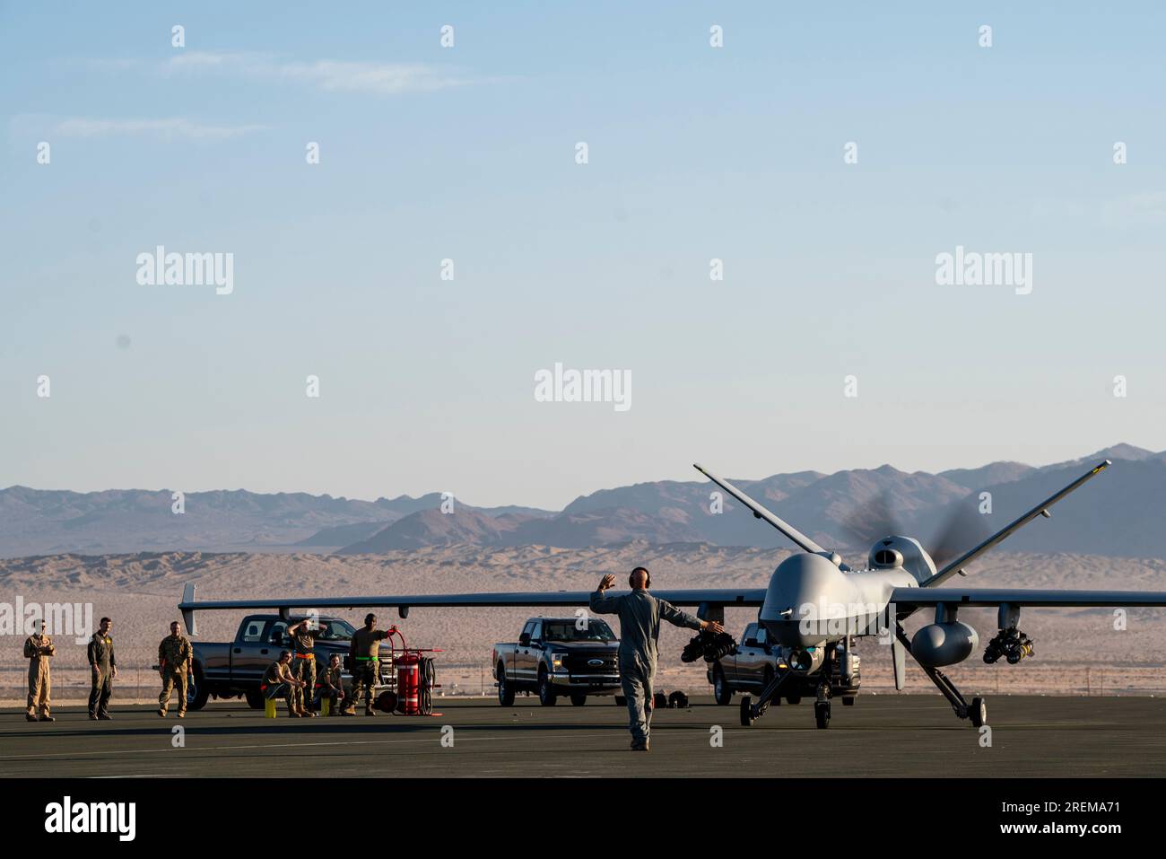 A U.S. Air Force Crew Chief from the 432nd Maintenance Squadron taxies ...