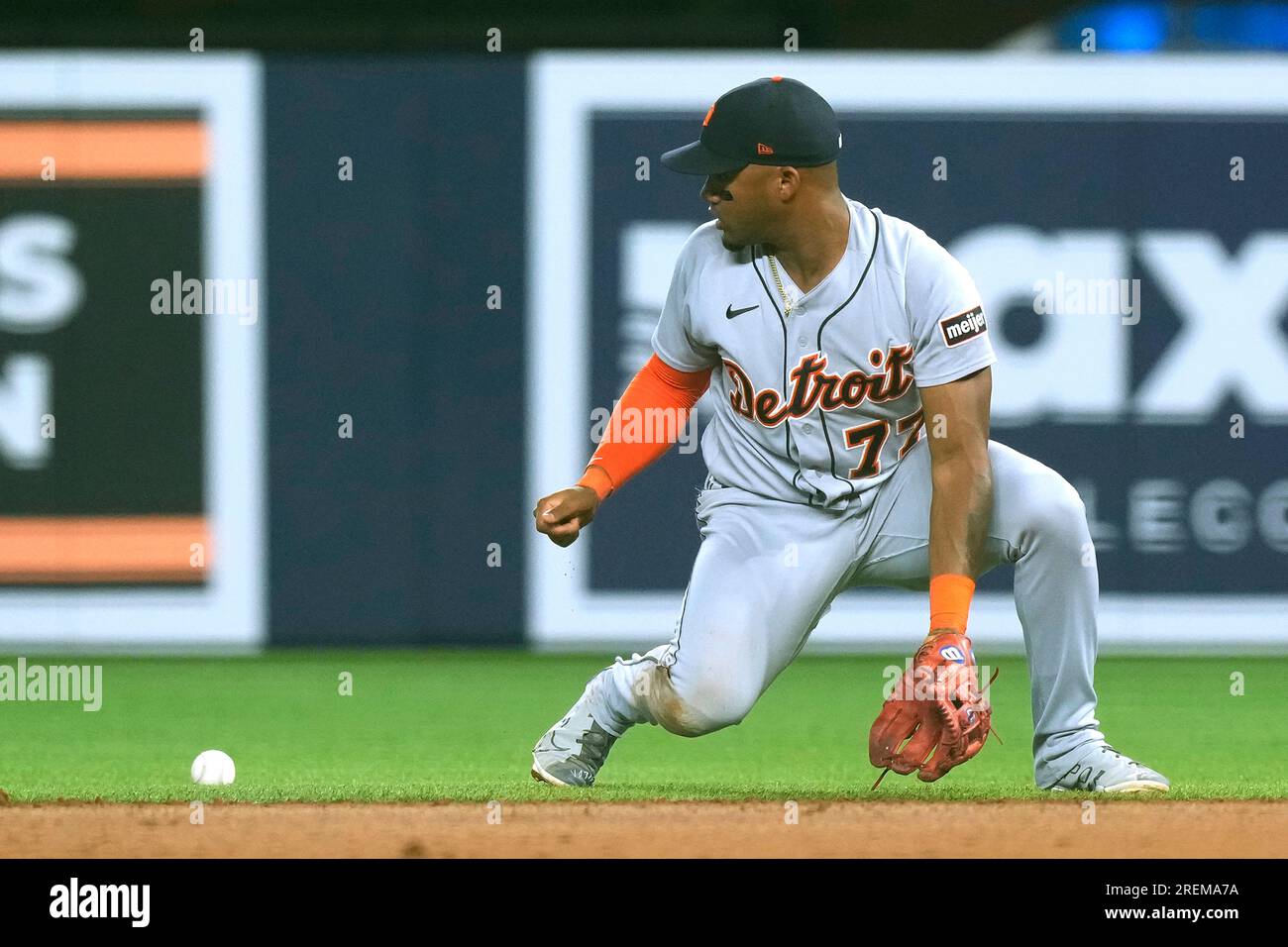 Detroit Tigers second baseman Andy Ibanez (77) makes a fielding error ...