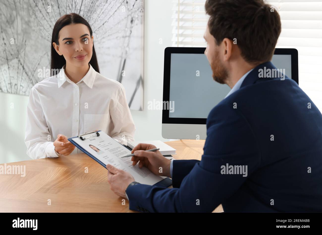 Human resources manager conducting job interview with applicant in office Stock Photo - Alamy