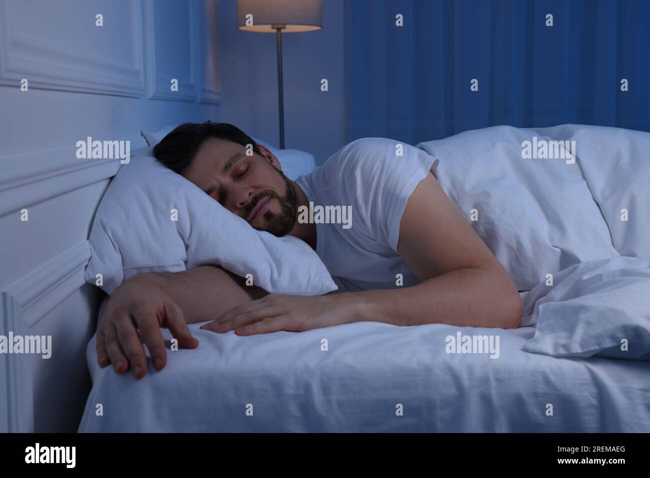 Man Sleeping In Bed At Night