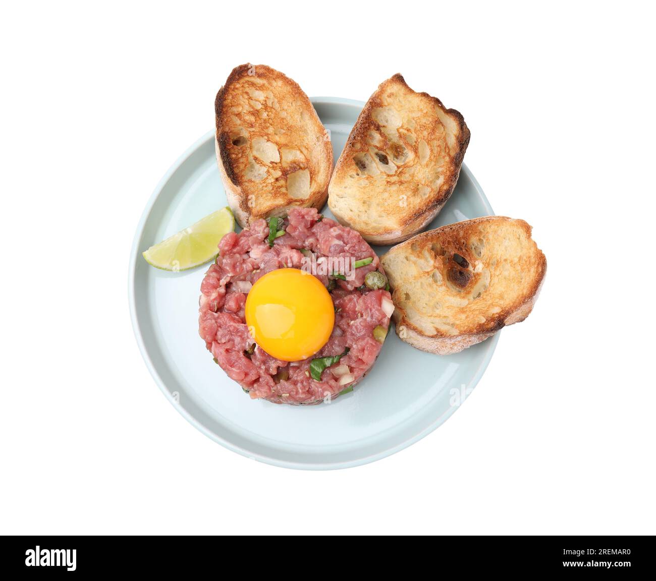 Tasty beef steak tartare served with yolk and toasted bread isolated on ...