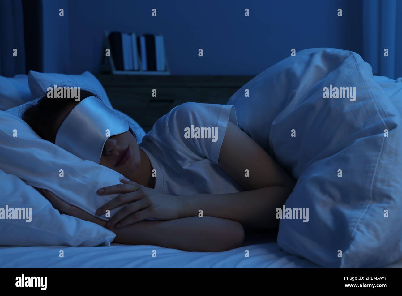 Woman sleeping dark room bed hi-res stock photography and images - Alamy