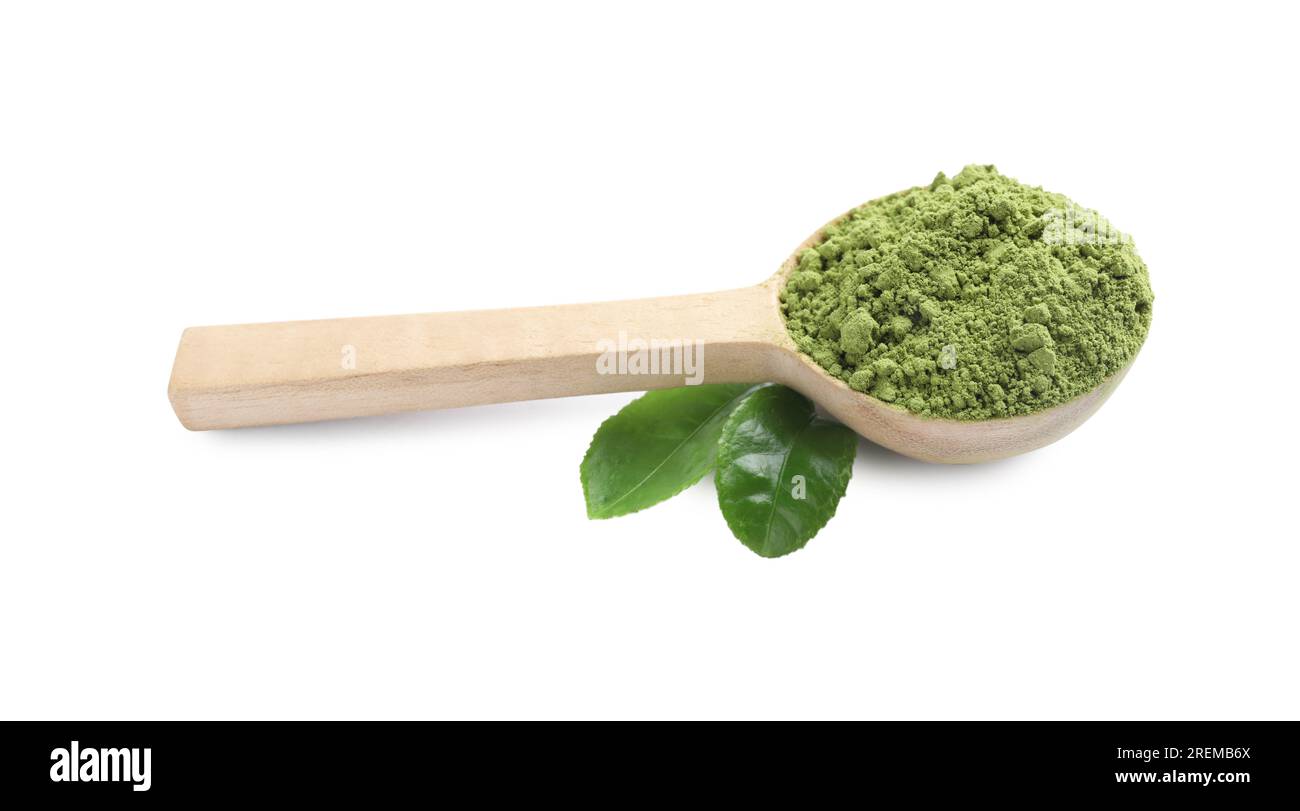 Wooden spoon with green matcha powder and leaves isolated on white ...