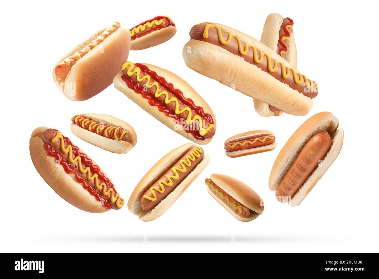 Many tasty hot dogs falling on white background Stock Photo - Alamy