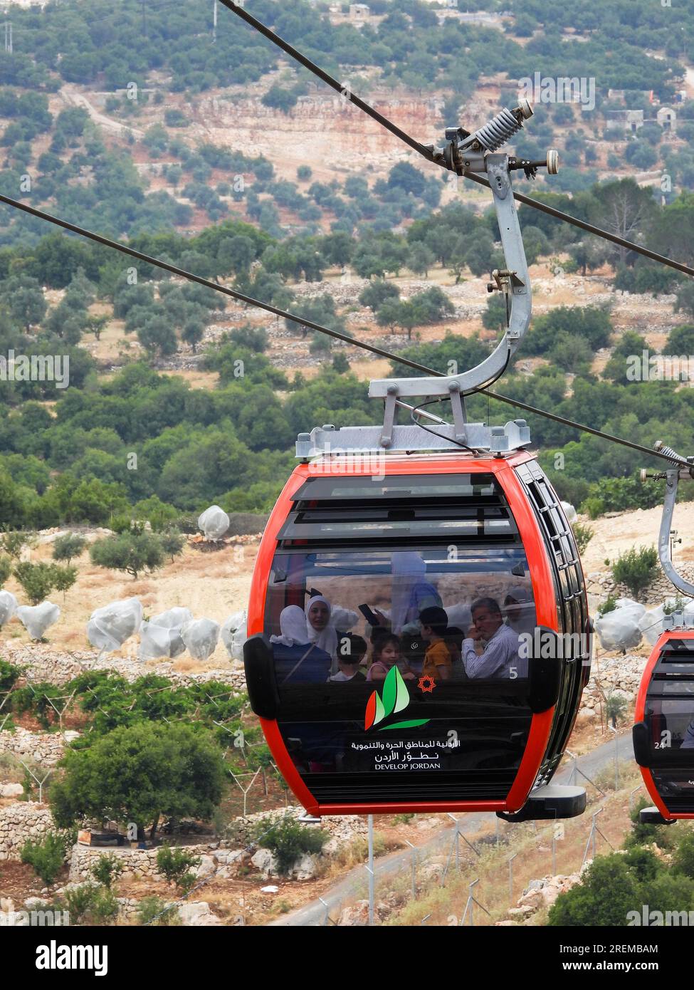 A group of people inside the cable cars of Ajloun, Jordan (Ajloun ...
