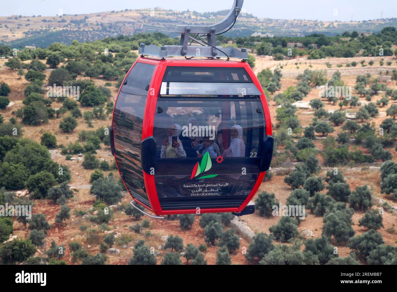 A group of people inside the cable cars of Ajloun, Jordan (Ajloun ...