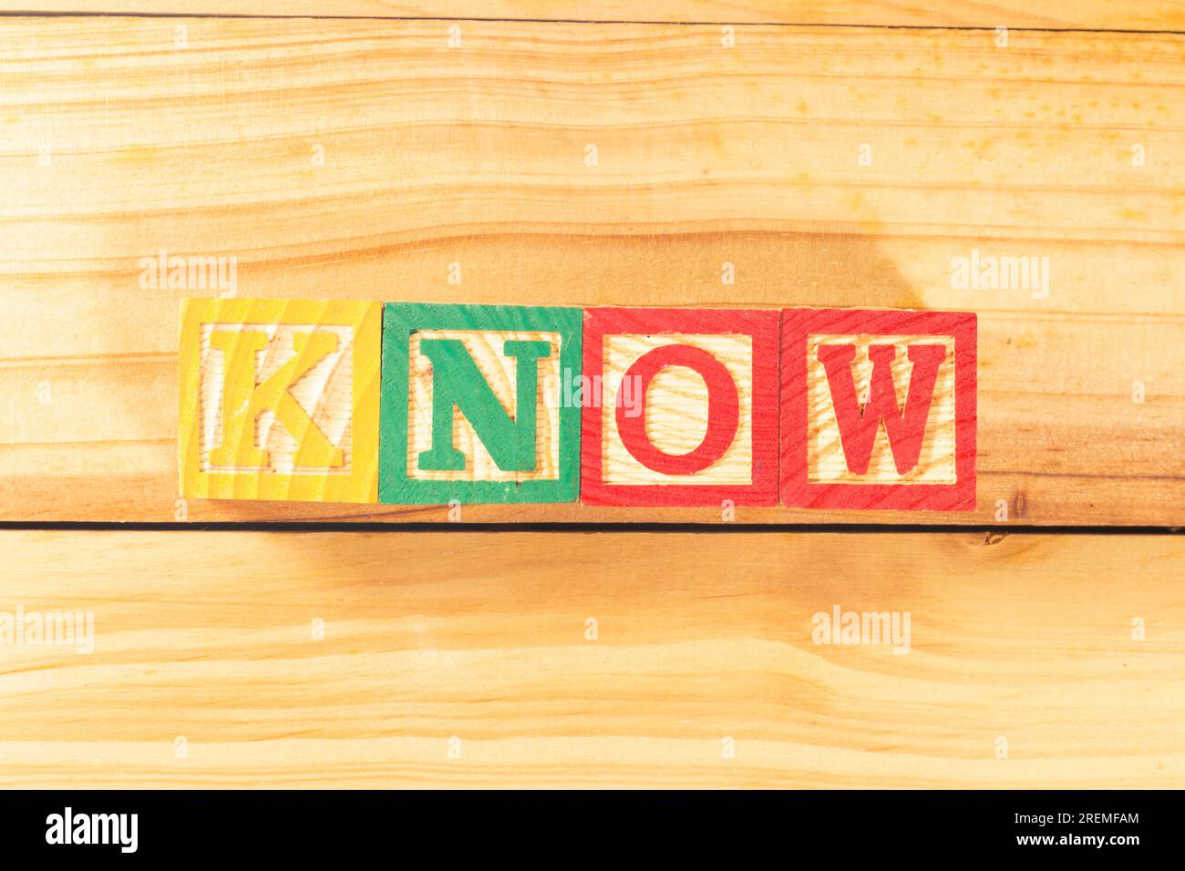 Spectacular colorful letters on wooden cubes on a wooden board with the ...