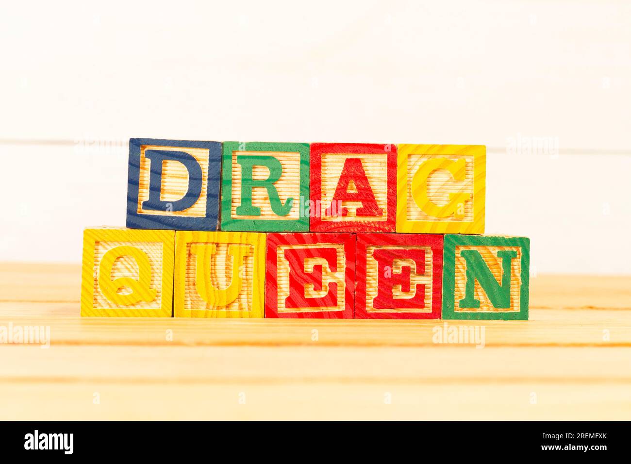 Spectacular colorful letters on wooden cubes on a wooden board with the ...