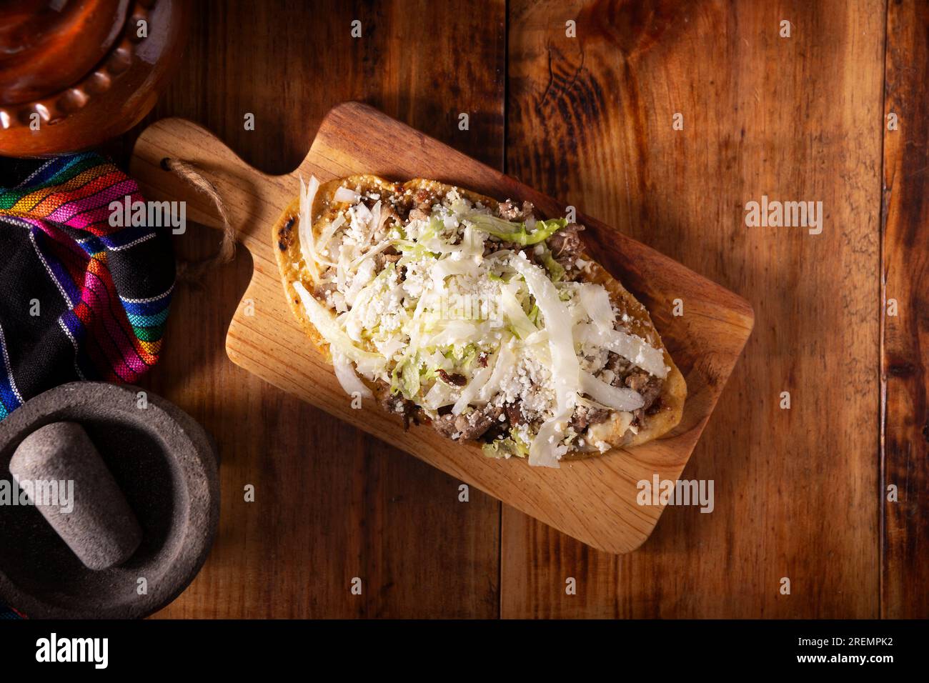 Huarache (food). Typical Mexican oval-shaped dish, made with corn dough ...