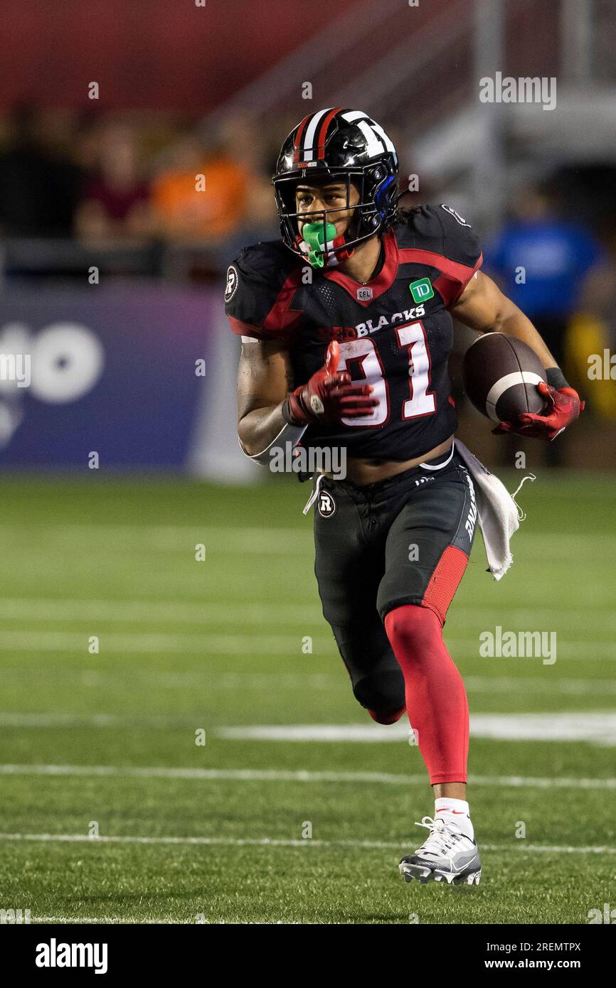 July 28, 2023: Ottawa Redblacks running back Devonte Williams (31) runs with the ball during the ...