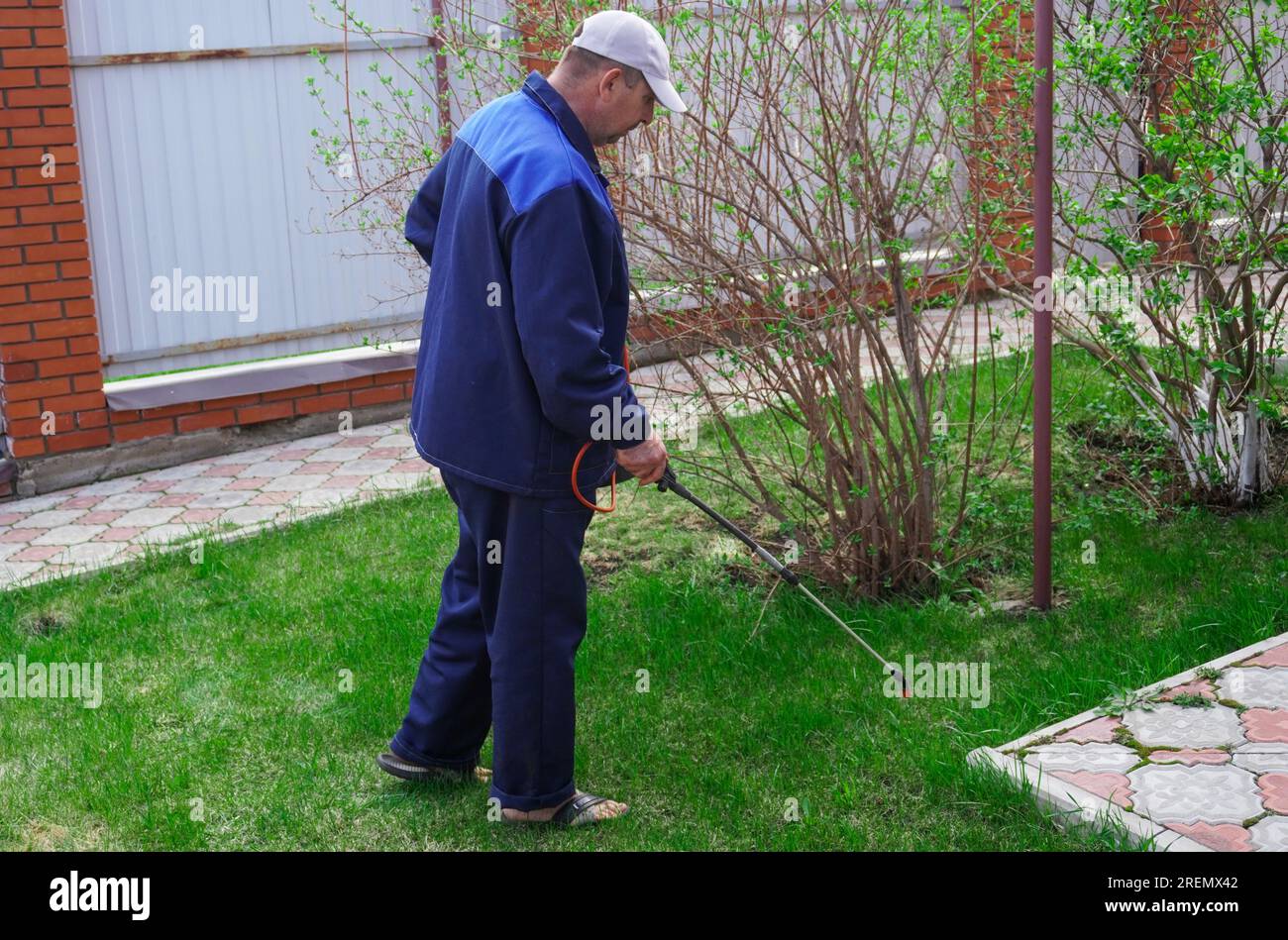 Man spraying weed killer in hi-res stock photography and images - Alamy
